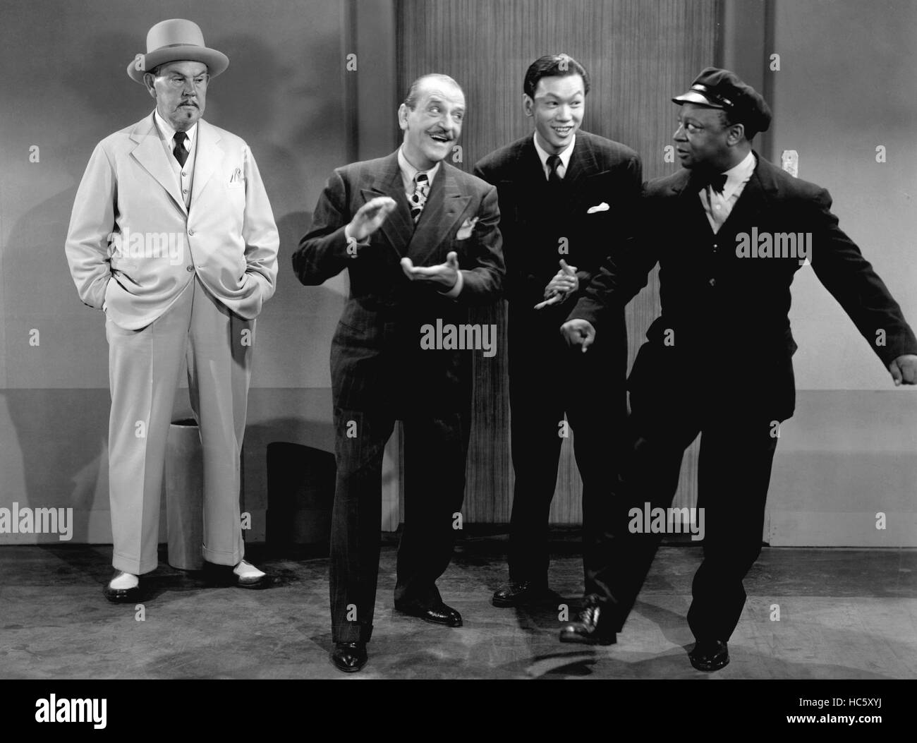THE SCARLET CLUE, from left: Sidney Toler as Charlie Chan, Jack Norton ...
