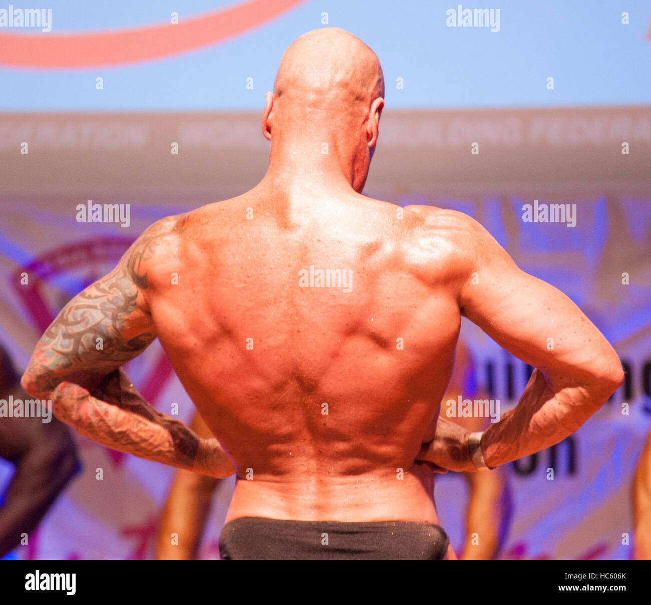 Male bodybuilder flexing thigh muscles hi-res stock photography and ...