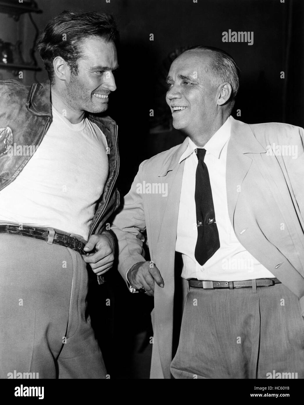SECRET OF THE INCAS, Charlton Heston, left, being visited on-set by his ...
