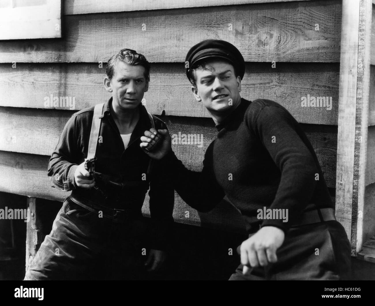 THE SEA SPOILERS, from left: Fuzzy Knight, John Wayne, 1936 Stock Photo ...