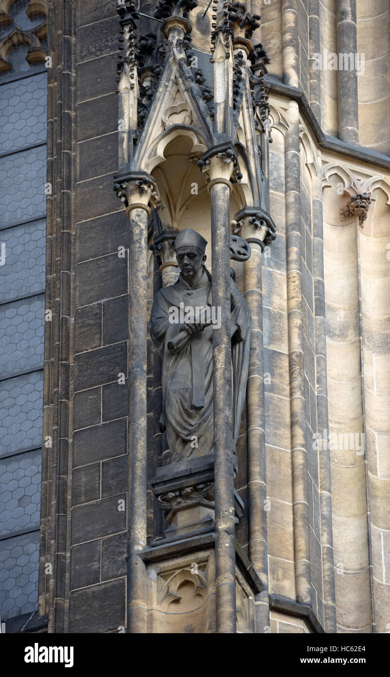 Priest sculpture in wall pinnacle of famous St. Vitus cathedral in ...