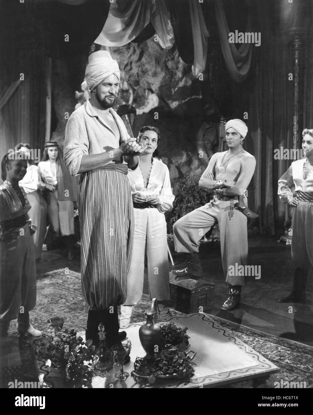 SON OF SINBAD, from left: Sally Forrest (in darkness), Vincent Price ...