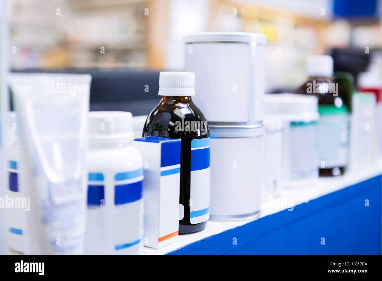 Various boxes and bottles of medicine on table Stock Photo - Alamy