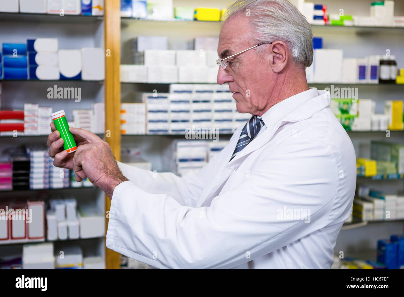 Pharmacist checking medicines Stock Photo - Alamy