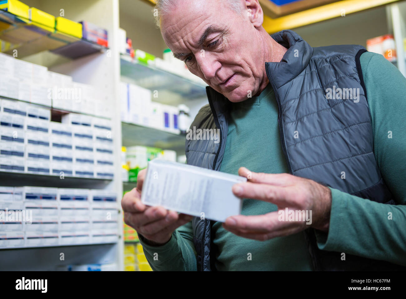 Customer checking a pill box Stock Photo - Alamy