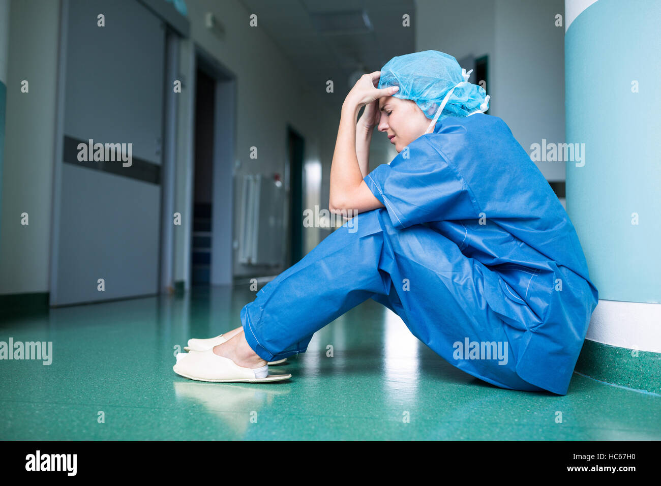 Sad surgeon sitting on floor hi-res stock photography and images - Alamy