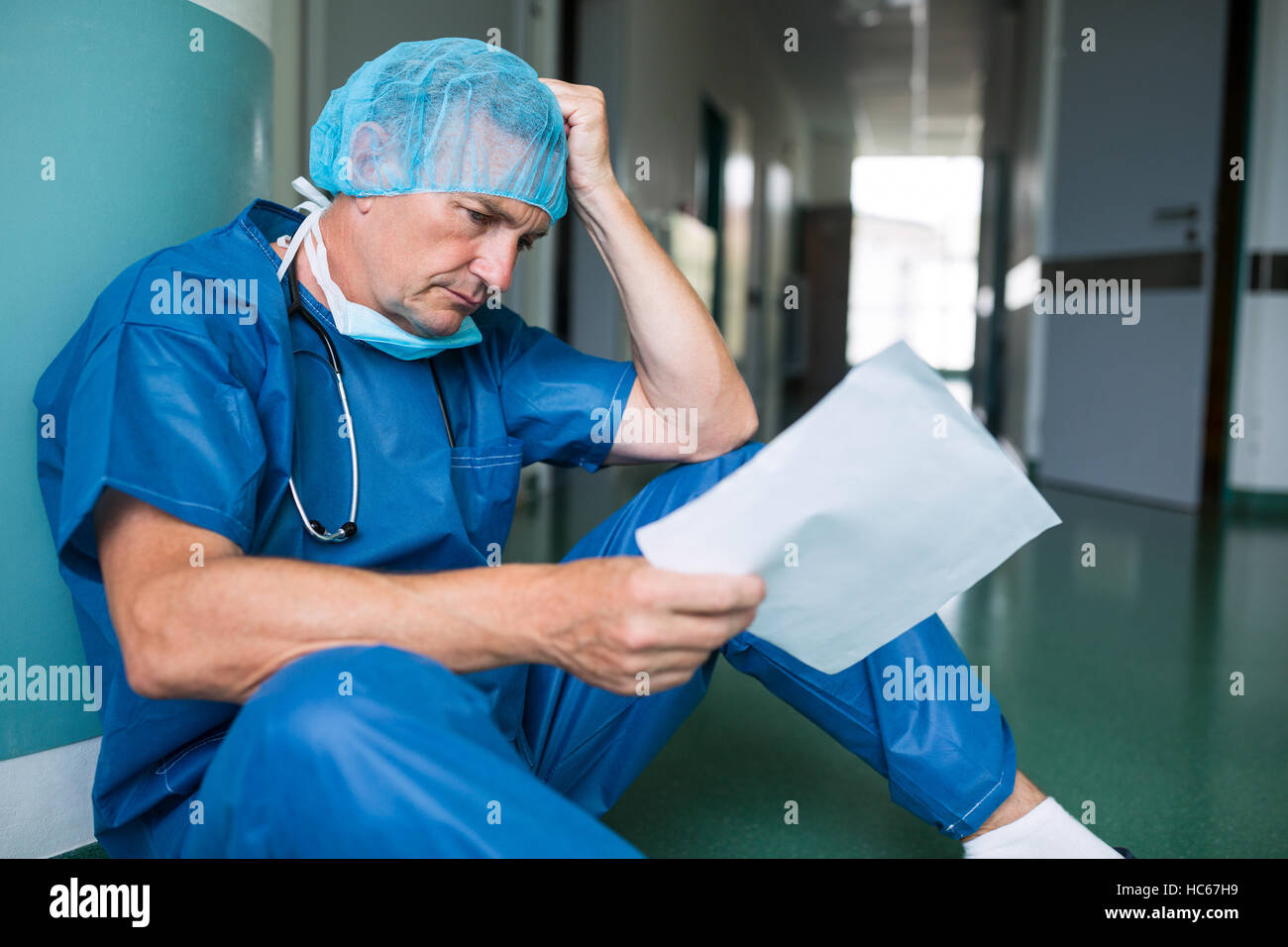 Sad surgeon sitting on floor hi-res stock photography and images - Alamy