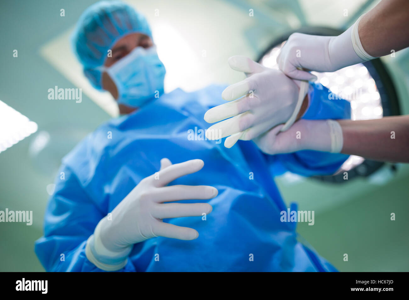 Elderly man wearing gloves hi-res stock photography and images - Alamy