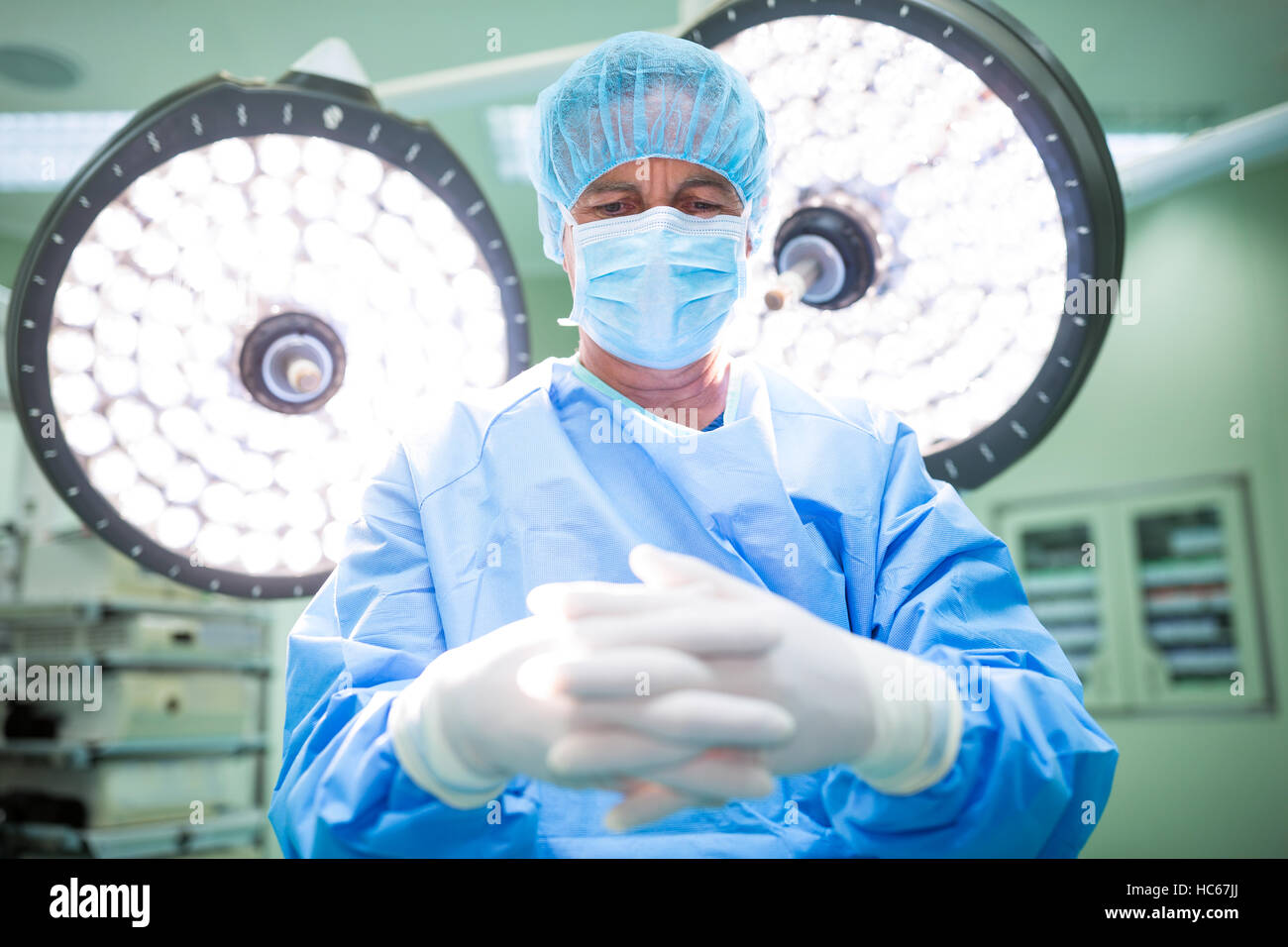 Surgeon preparing for operation in operation room Stock Photo - Alamy