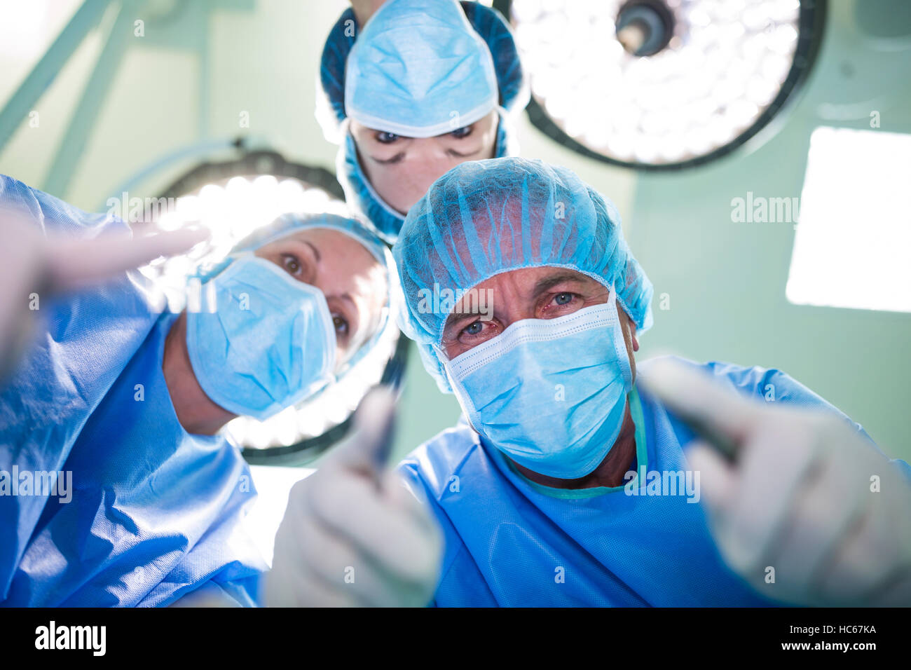 Elderly doctor performing surgery hi-res stock photography and images ...