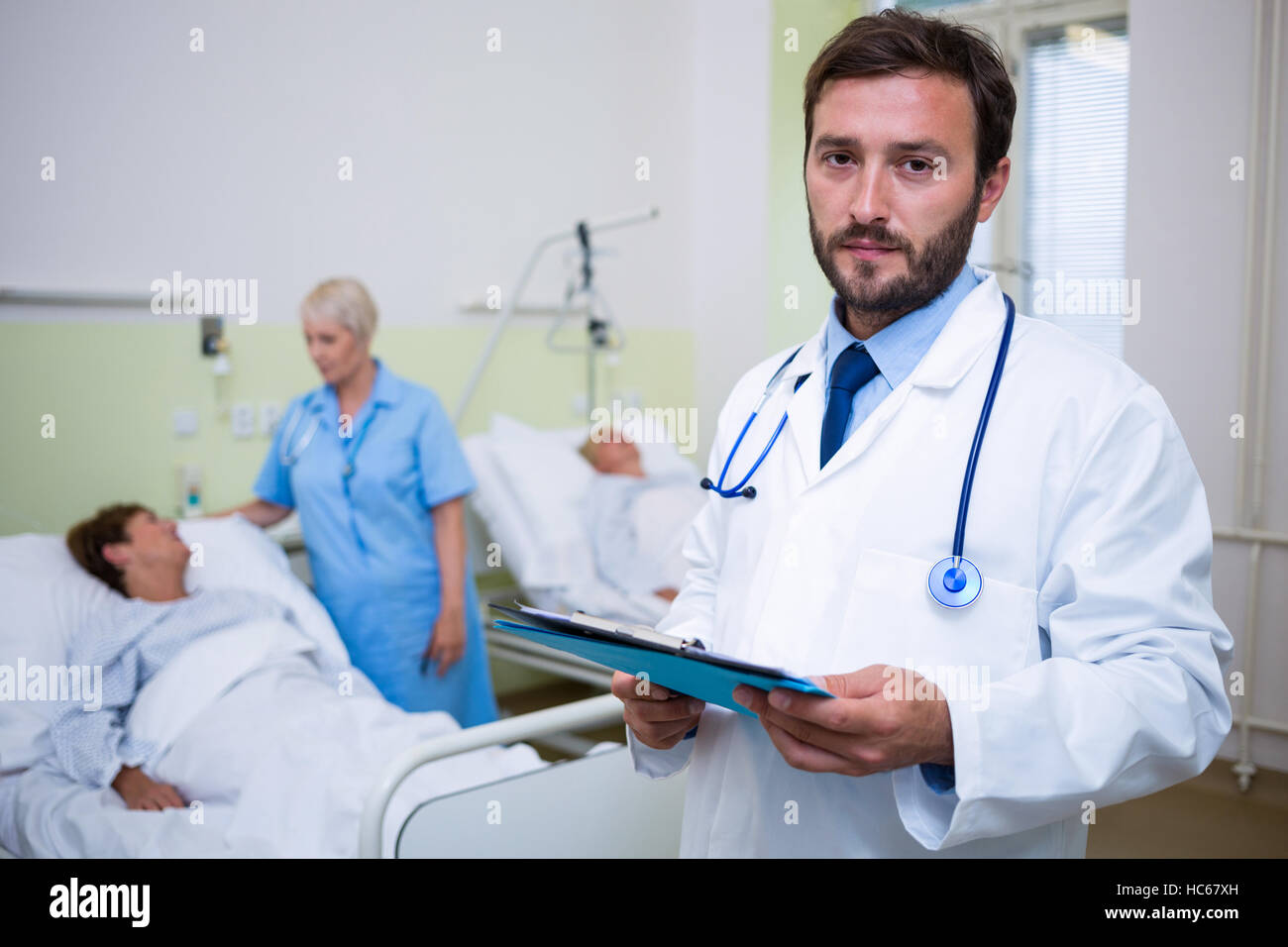 Portrait of doctor checking a medical report Stock Photo - Alamy