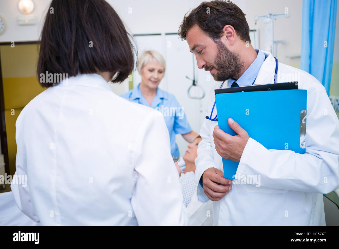 Doctor and nurse interacting with each other Stock Photo - Alamy