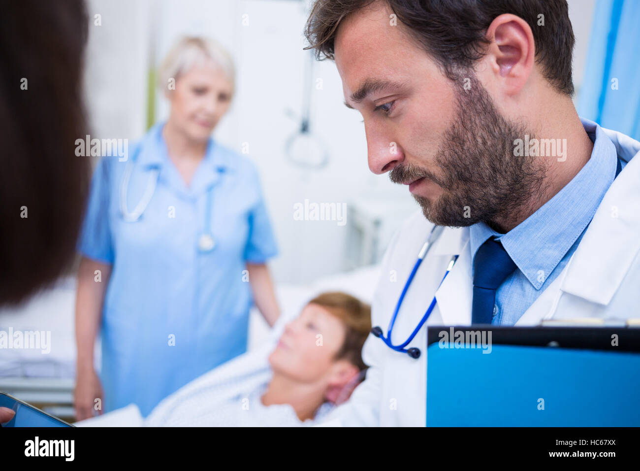 Doctor and nurse interacting with each other Stock Photo - Alamy