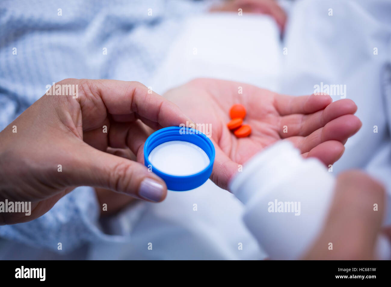 Nurse giving medication to patient Stock Photo - Alamy