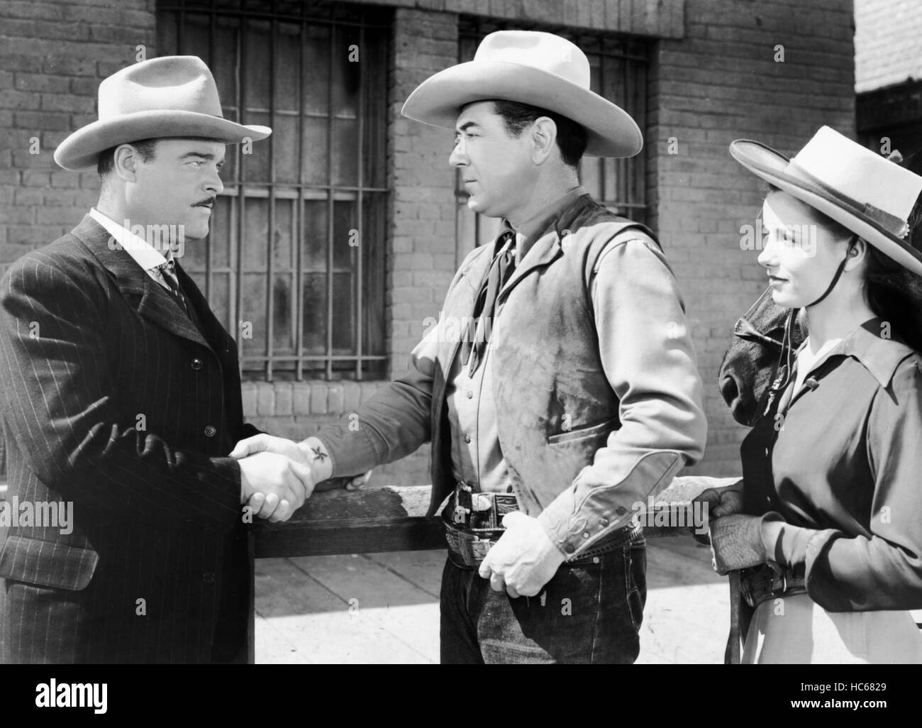 SHADOWS ON THE RANGE, center: Johnny Mack Brown, right: Jan Bryant ...