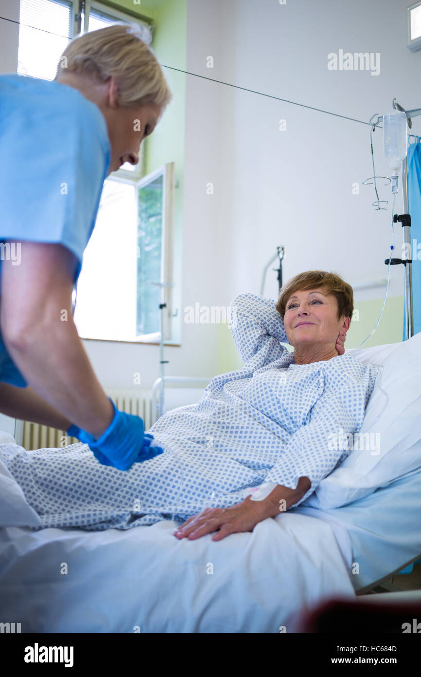 Nurse giving an injection to a patient Stock Photo - Alamy