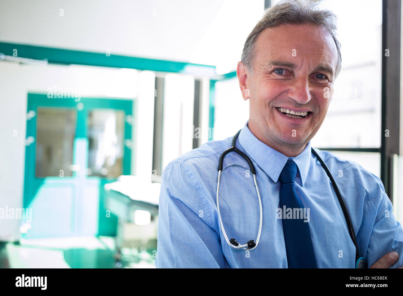 Portrait of doctor smiling at camera Stock Photo - Alamy