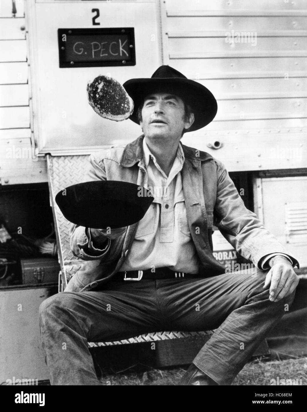 SHOOT OUT, Gregory Peck developing proficiency at flapjack flipping for an upcoming scene, on ...