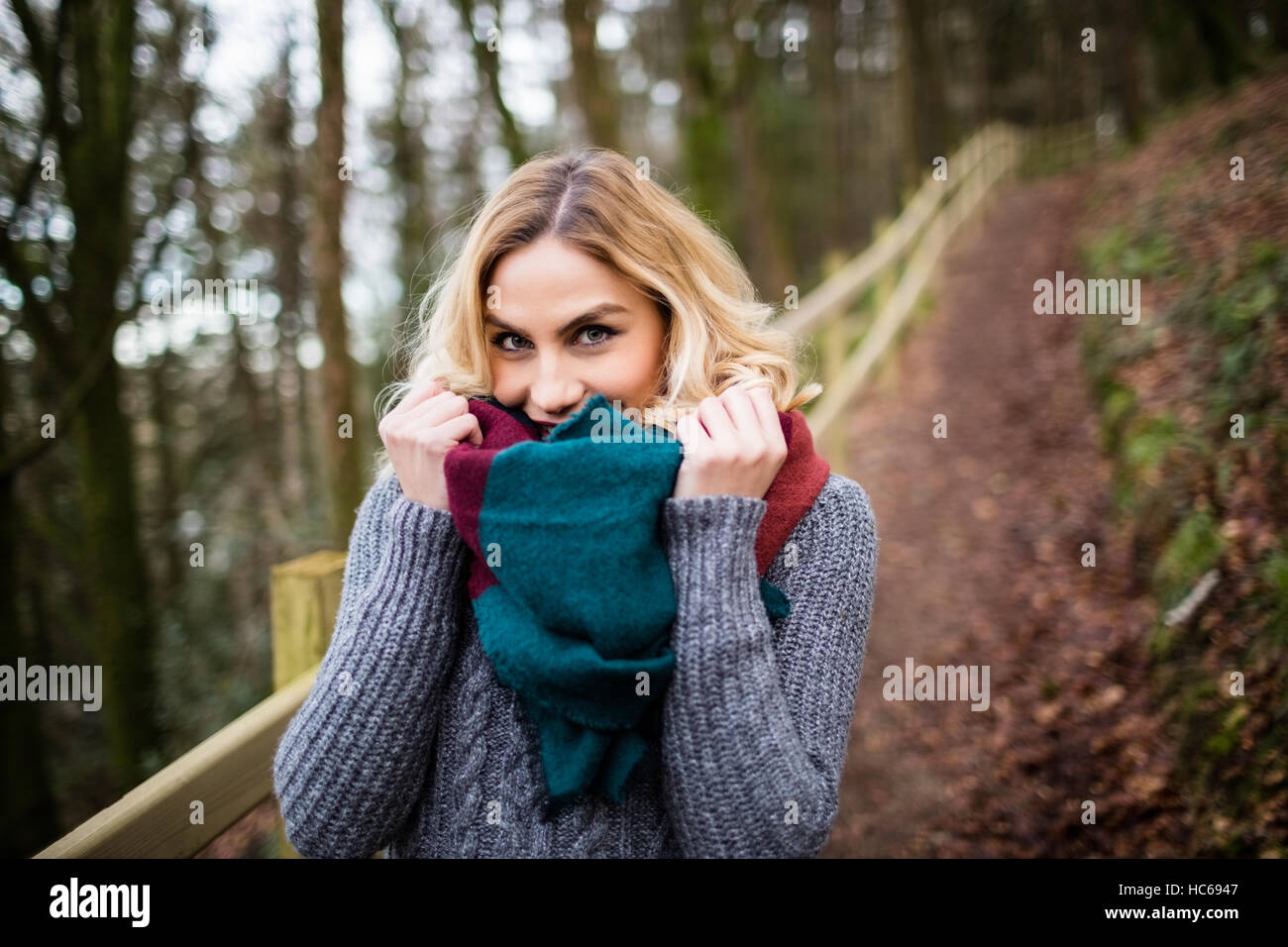 Beautiful smiling woman in forest Stock Photo - Alamy