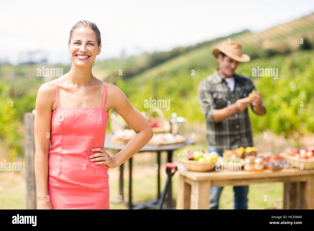 Portrait of female customer standing in front of stall Stock Photo - Alamy