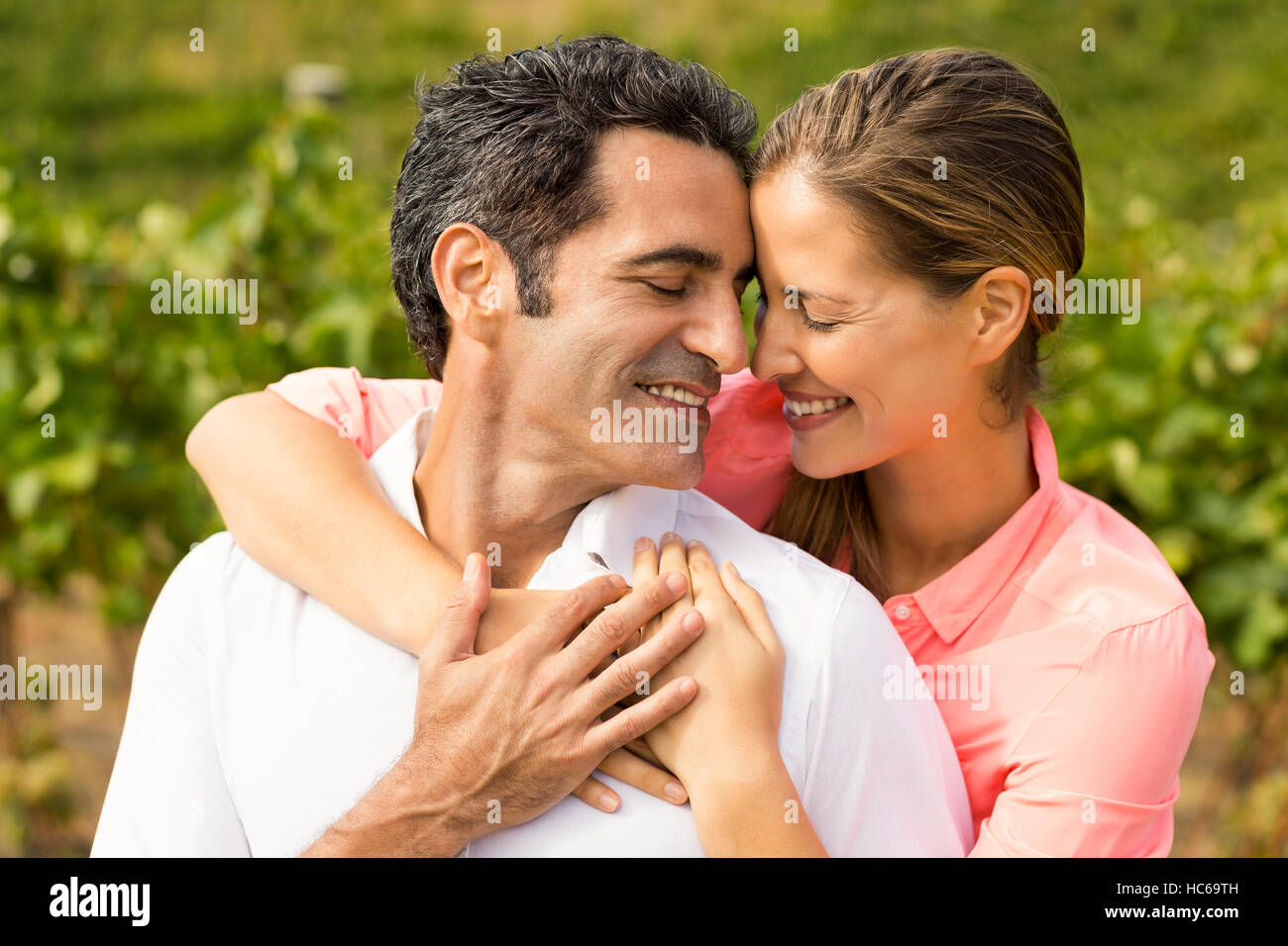 Happy couple embracing each other Stock Photo - Alamy