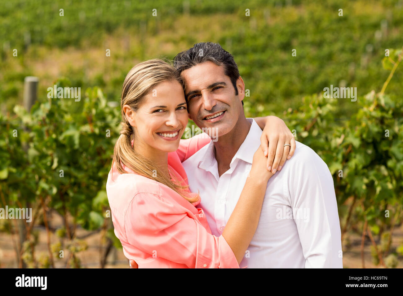 Portrait of happy couple embracing each other Stock Photo - Alamy