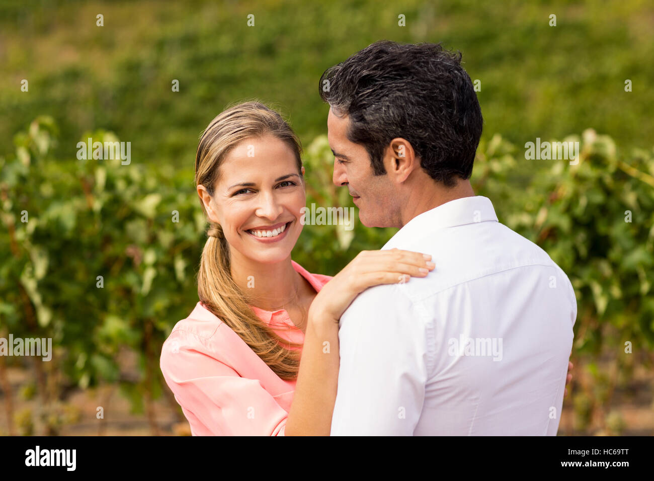 Happy couple embracing each other Stock Photo - Alamy