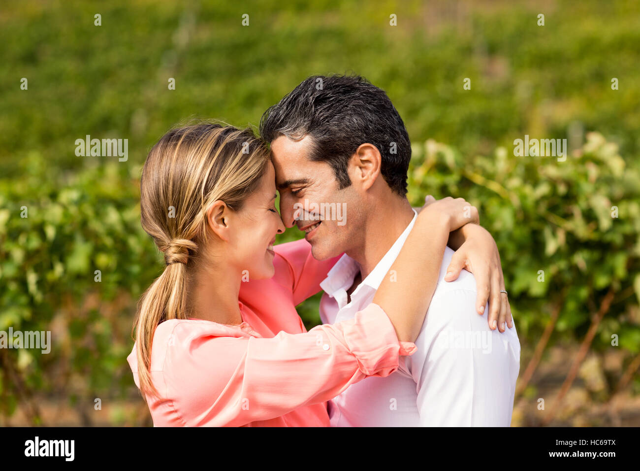 Happy couple embracing each other Stock Photo - Alamy