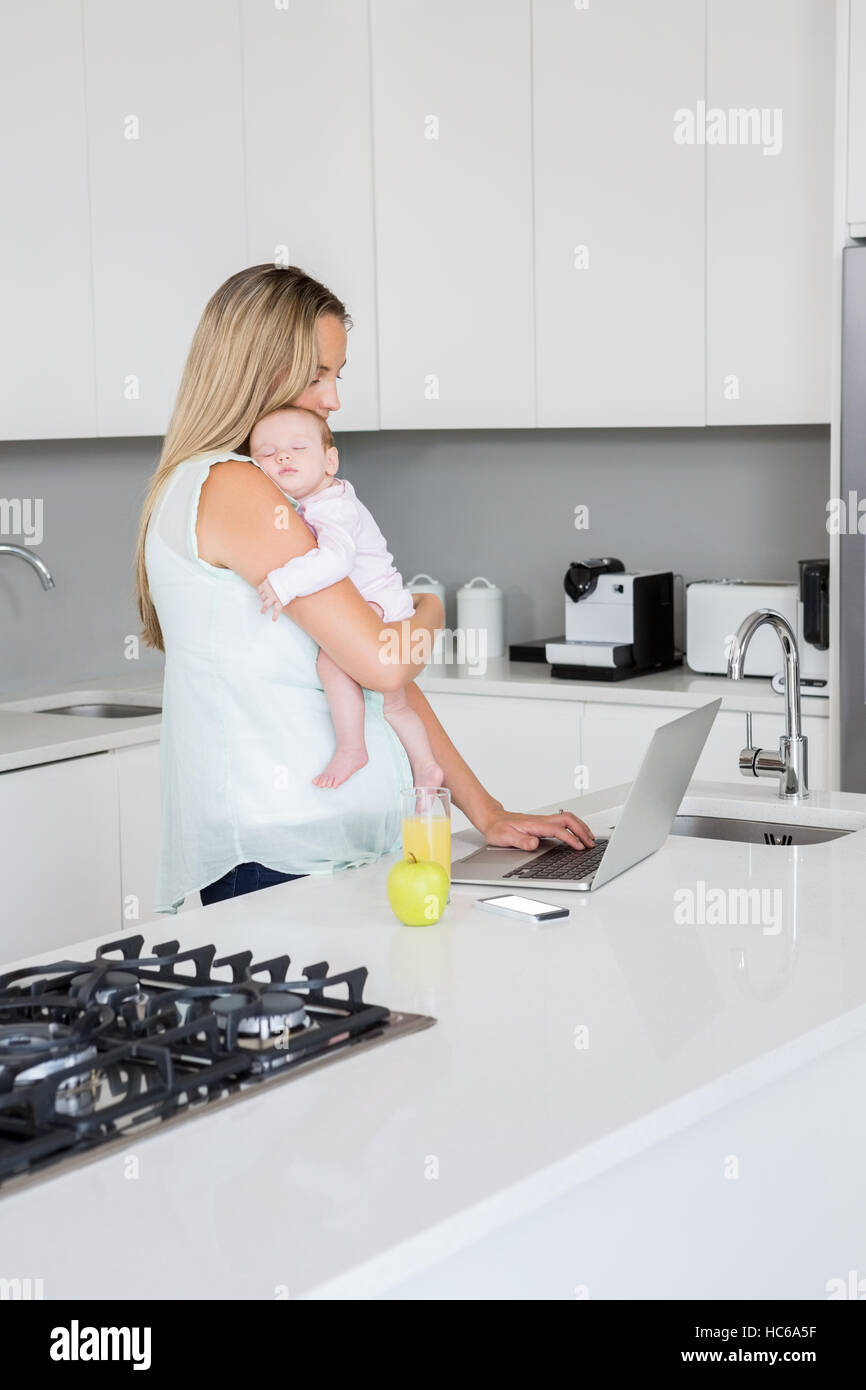 Mother typing hi-res stock photography and images - Alamy