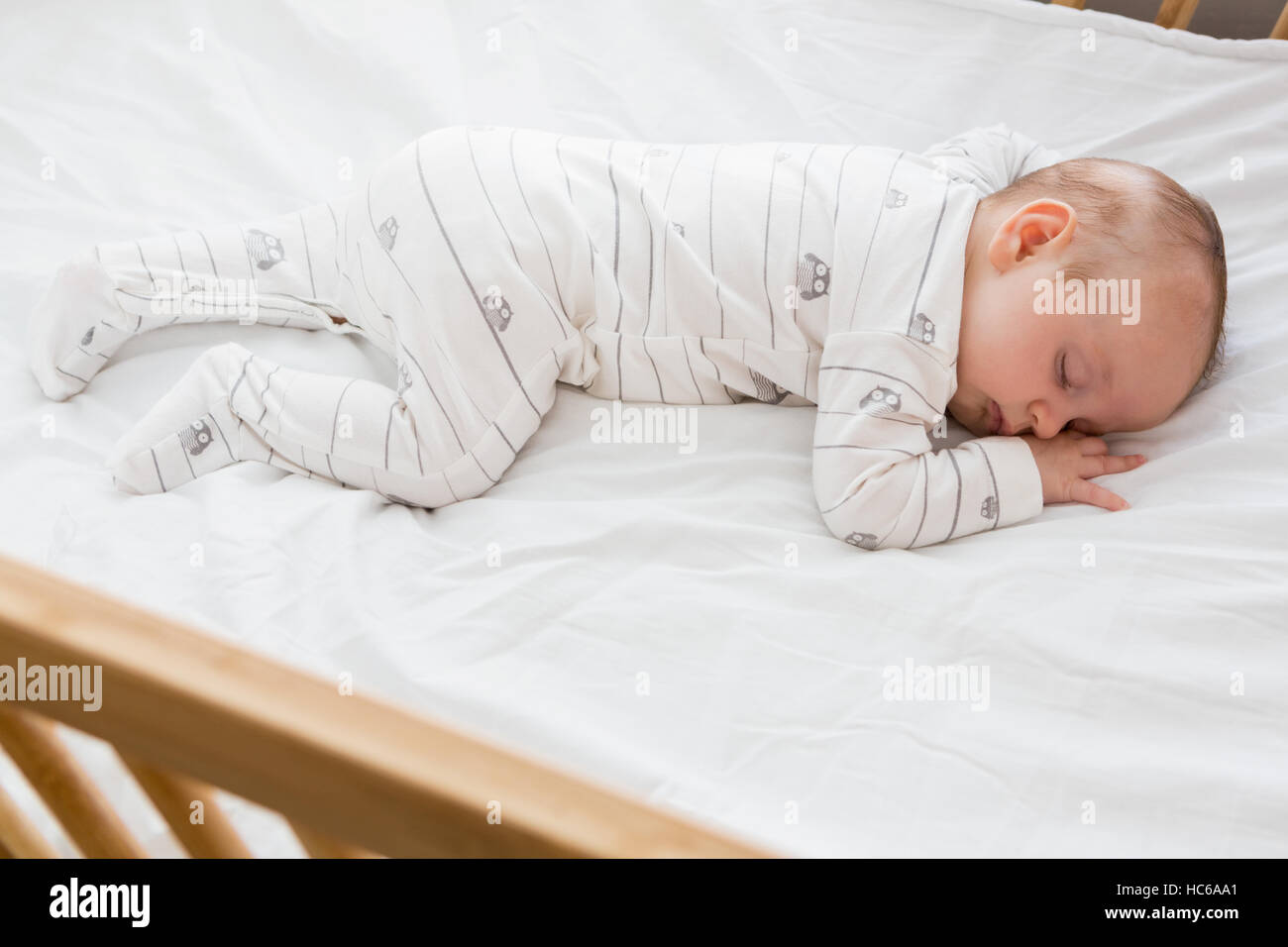Baby boy sleeping on a cradle Stock Photo - Alamy
