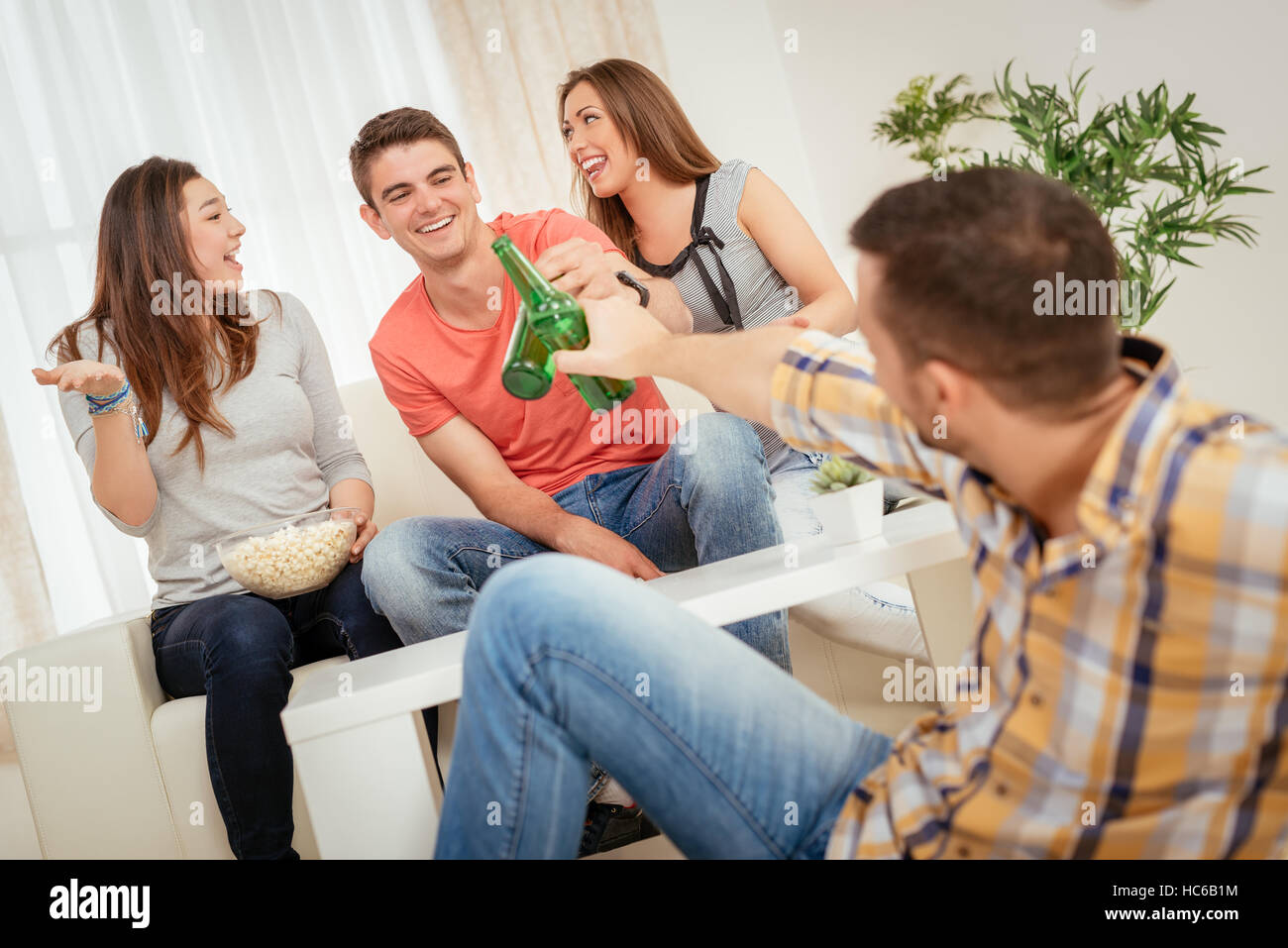 Hanging out with friends at home hi-res stock photography and images ...