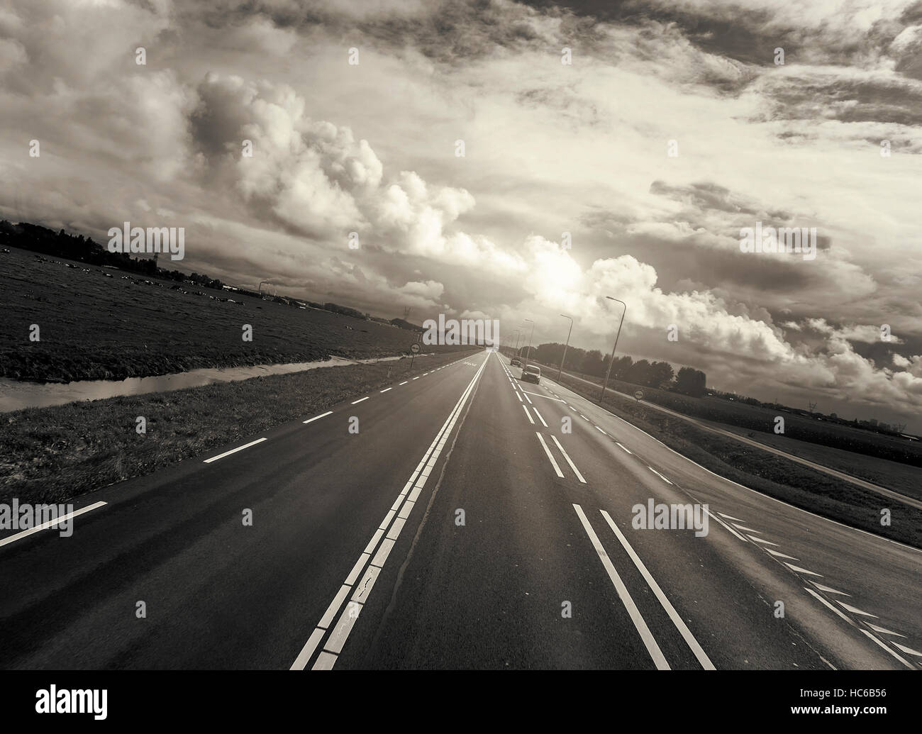 Car Highway at sunset Stock Photo - Alamy