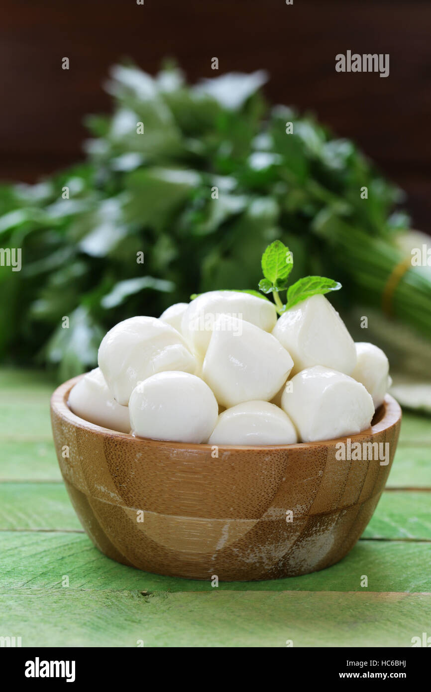 Mini mozzarella cheese in a wooden bowl Stock Photo - Alamy