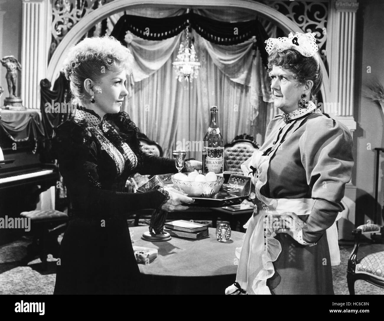 THE SPOILERS, form left: Anne Baxter, Ruth Donnelly, 1955 Stock Photo ...