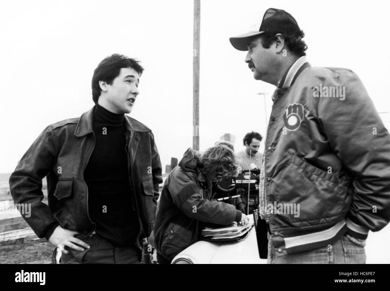 THE SURE THING, from left: John Cusack, director Rob Reiner on set ...