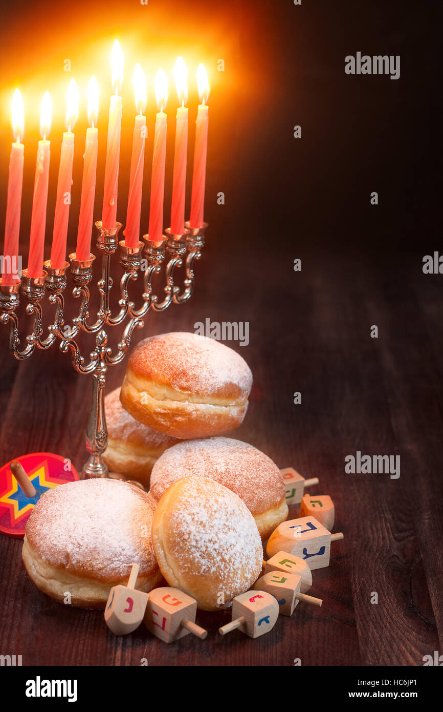 Symbols of jewish holiday hanukkah - menorah, donuts sufganiyot and ...