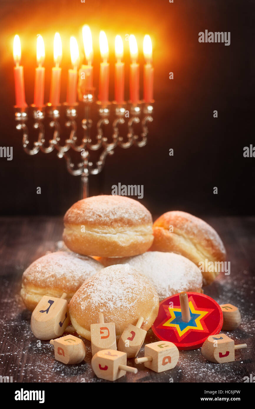 Symbols of jewish holiday hanukkah - menorah, donuts sufganiyot and ...