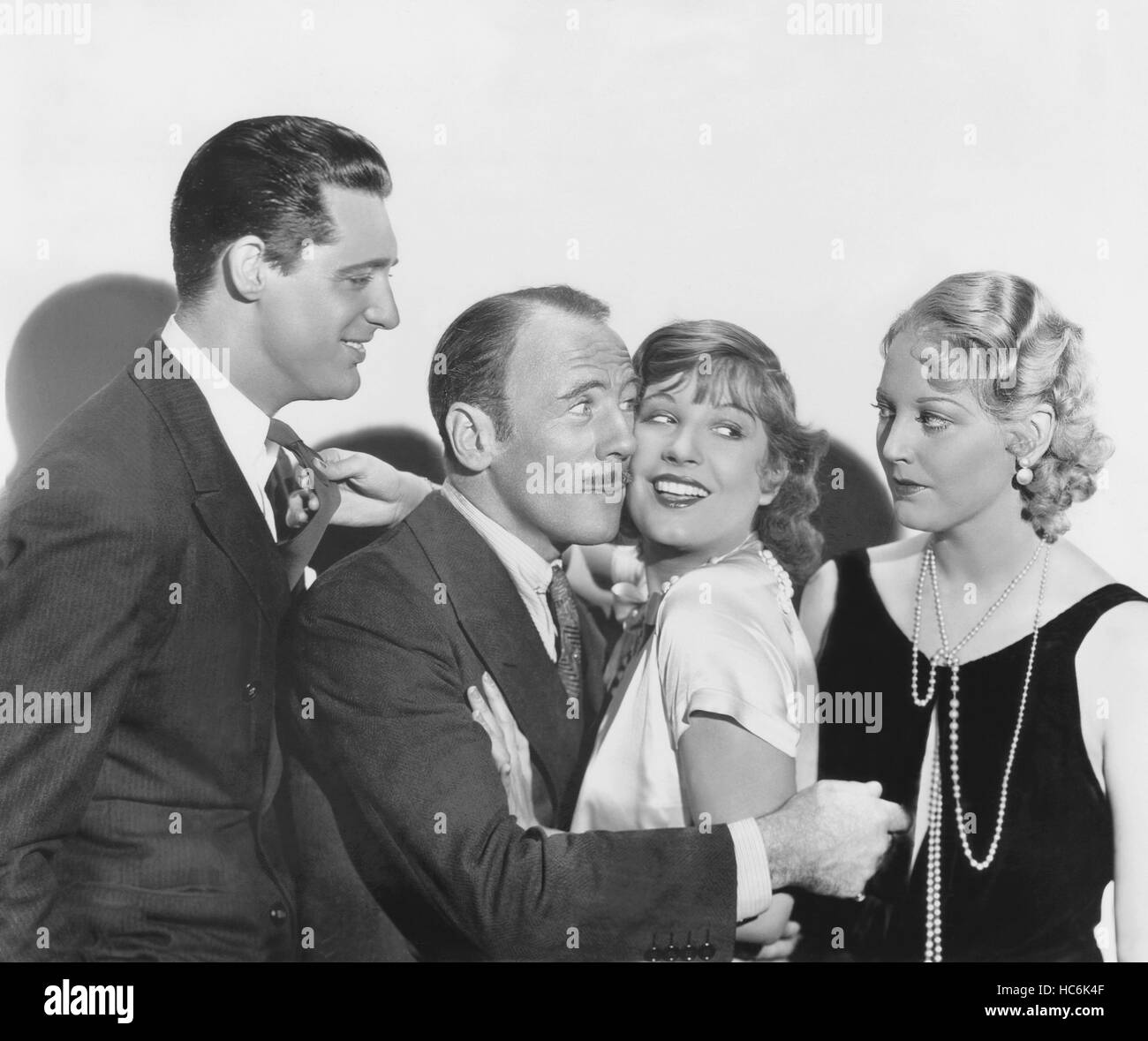 THIS IS THE NIGHT, from left: Cary Grant, Roland Young, Lili Damita ...