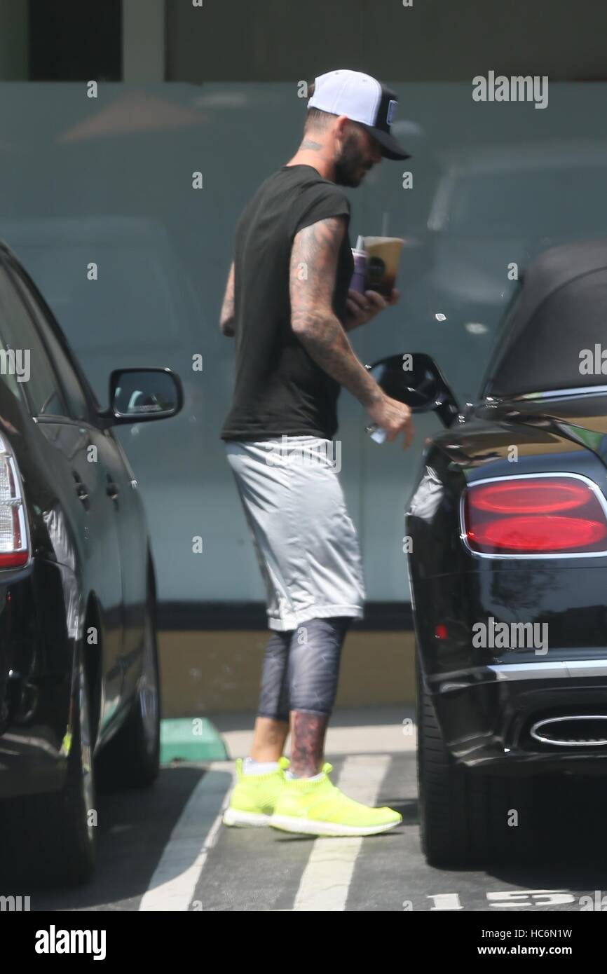 David Beckham stops for a health shake wearing a ANTI HERO baseball cap ...