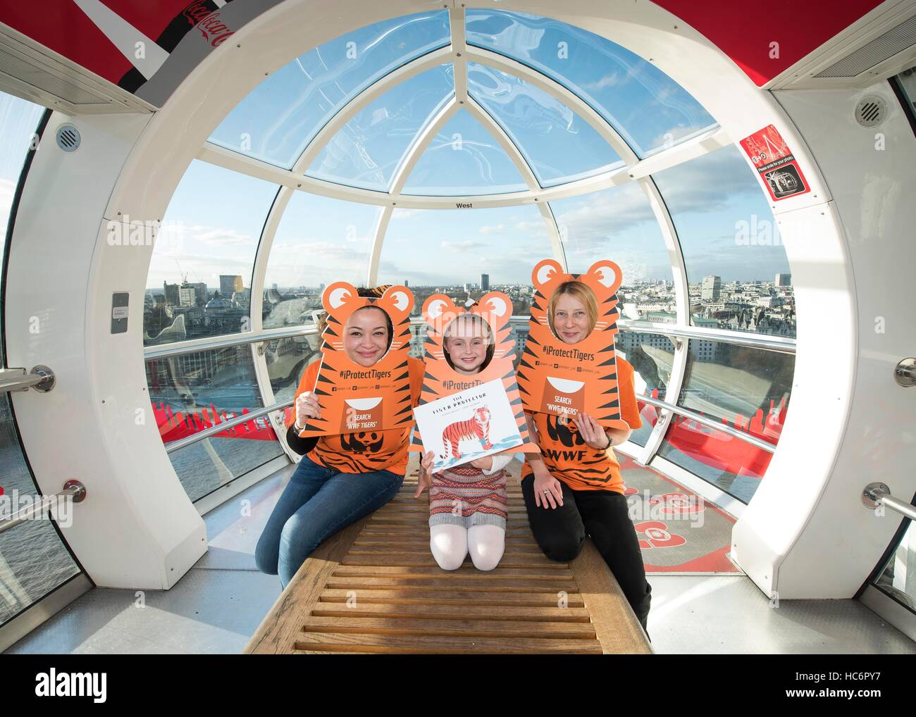 (L-R) Fru Kozma, Ruby Cutts and Becci May hold up I Protect Tigers ...