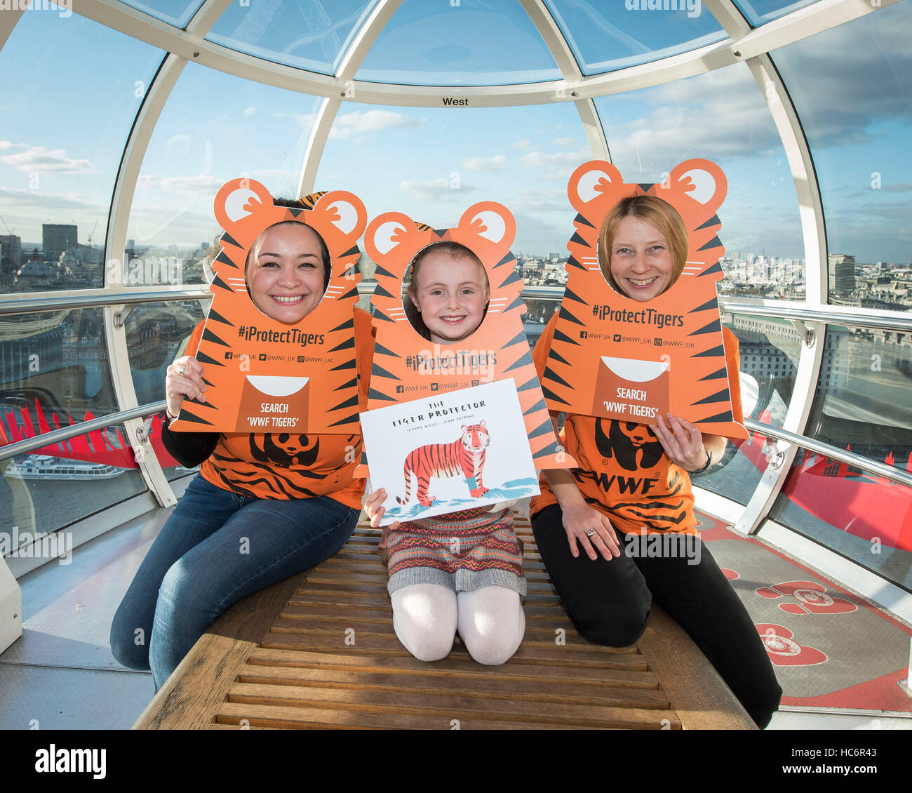 (L-R) Fru Kozma, Ruby Cutts and Becci May hold up I Protect Tigers ...