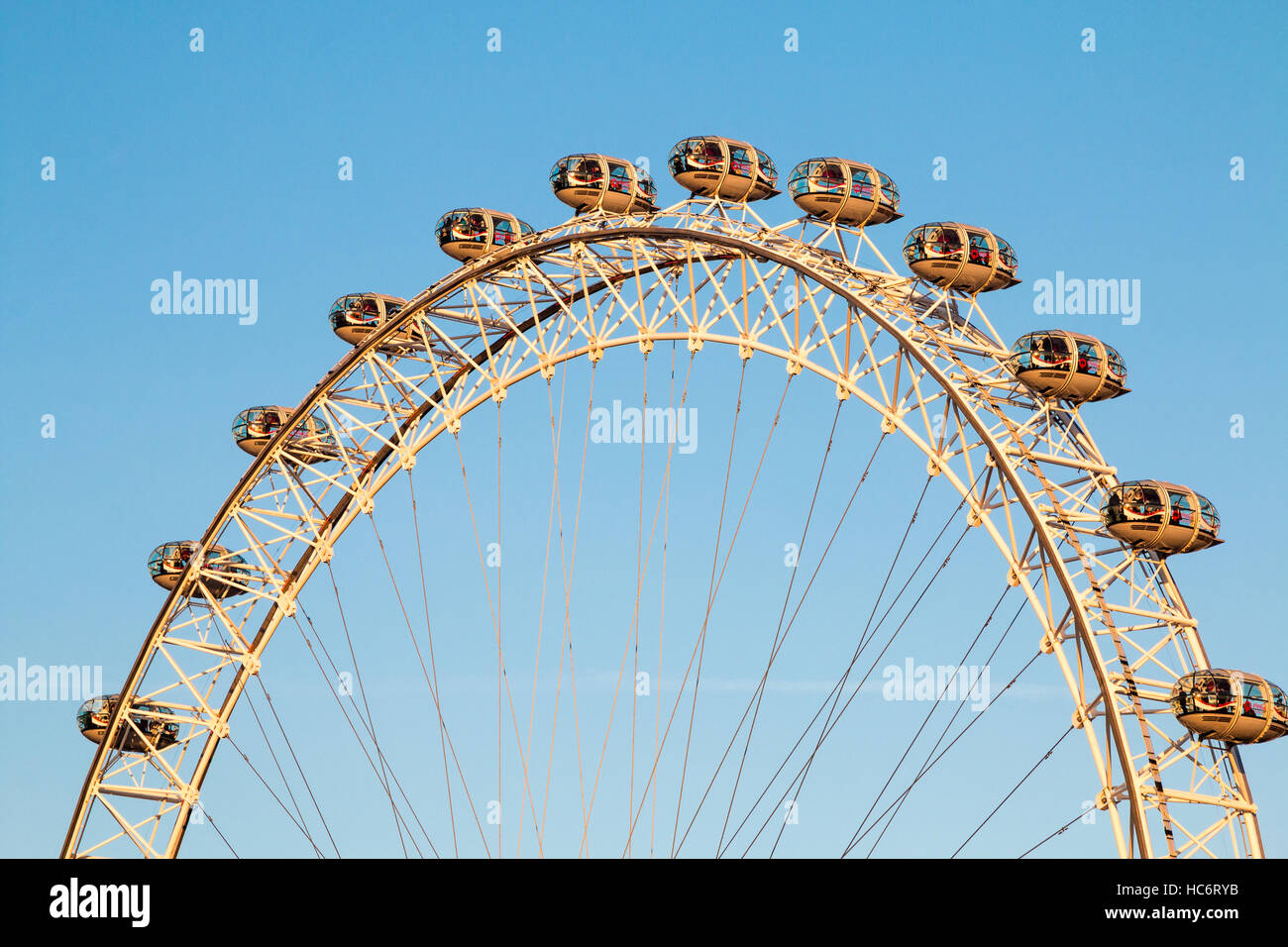 London Eye in afternoon winter sunlight. The London Eye is set against ...