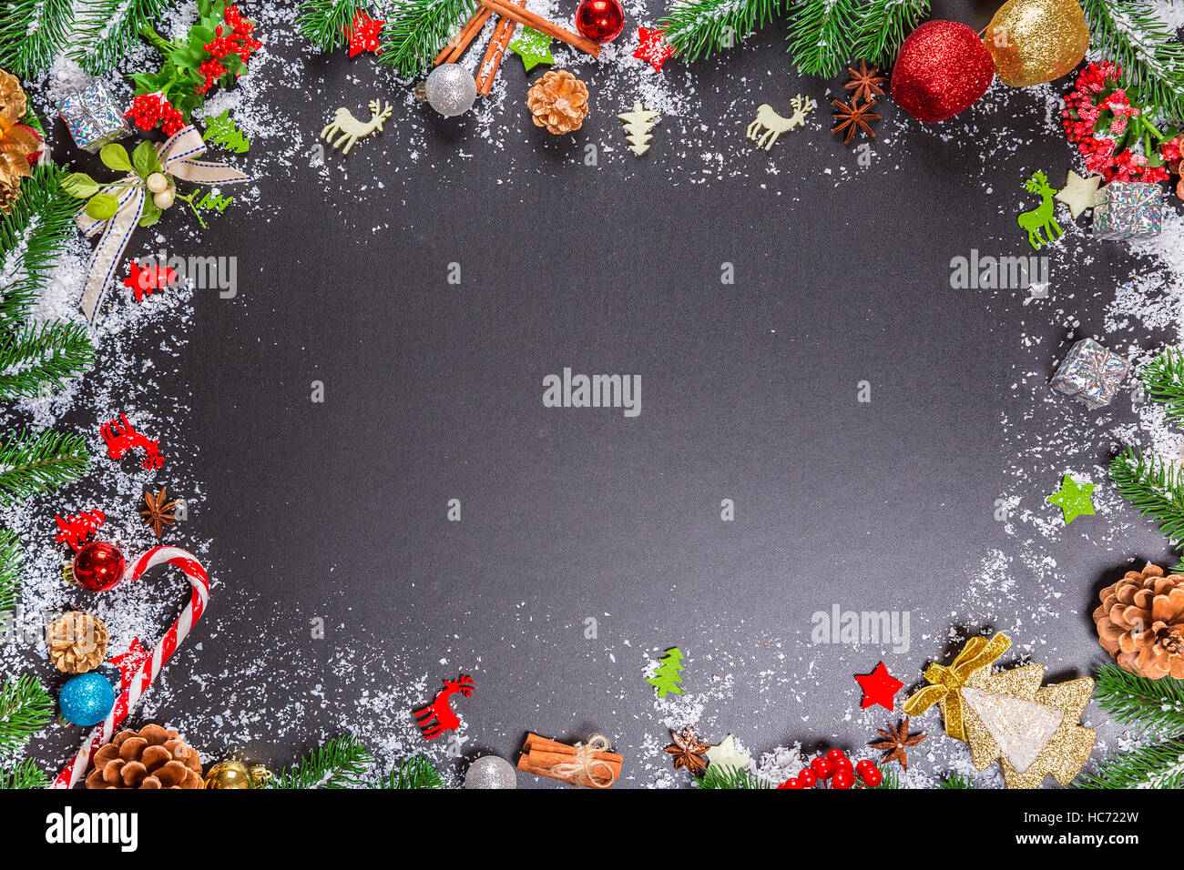 Christmas holiday background with snow fir tree, candy, winter spices ...
