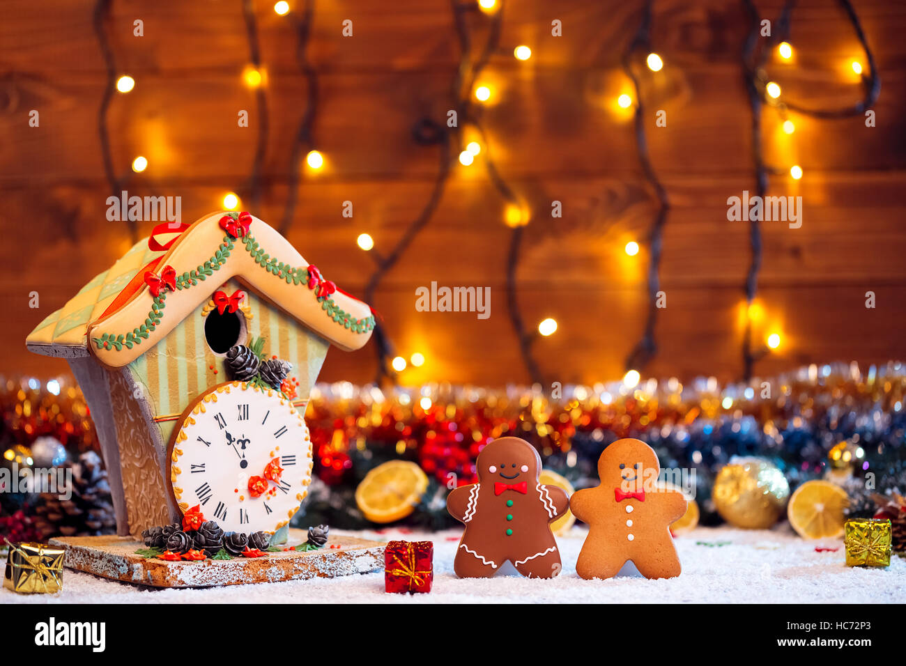 Christmas Gingerbread House with clock and two cookies man with fir ...