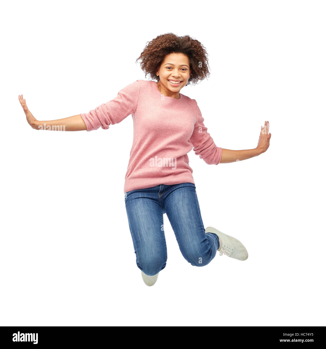happy african american woman jumping over white Stock Photo - Alamy