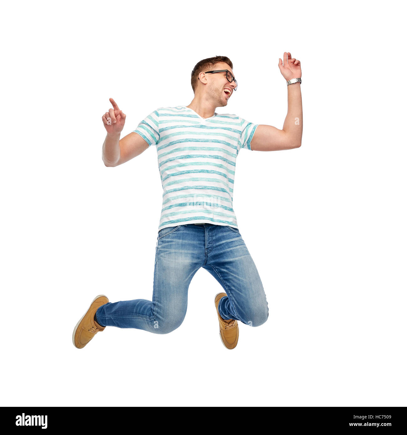 happy young man jumping in air Stock Photo - Alamy