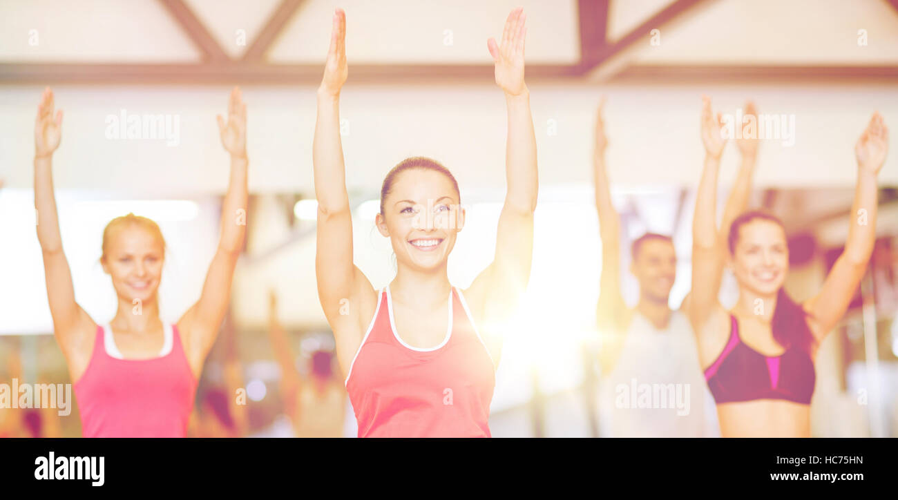 group of smiling people exercising in the gym Stock Photo - Alamy