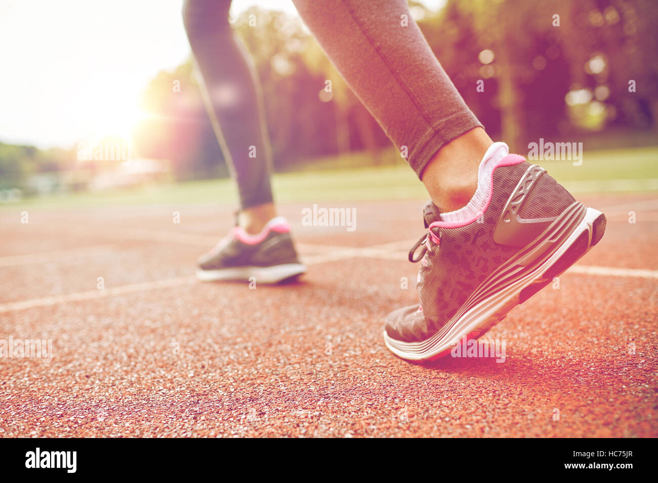 close up of woman feet running on track from back Stock Photo - Alamy