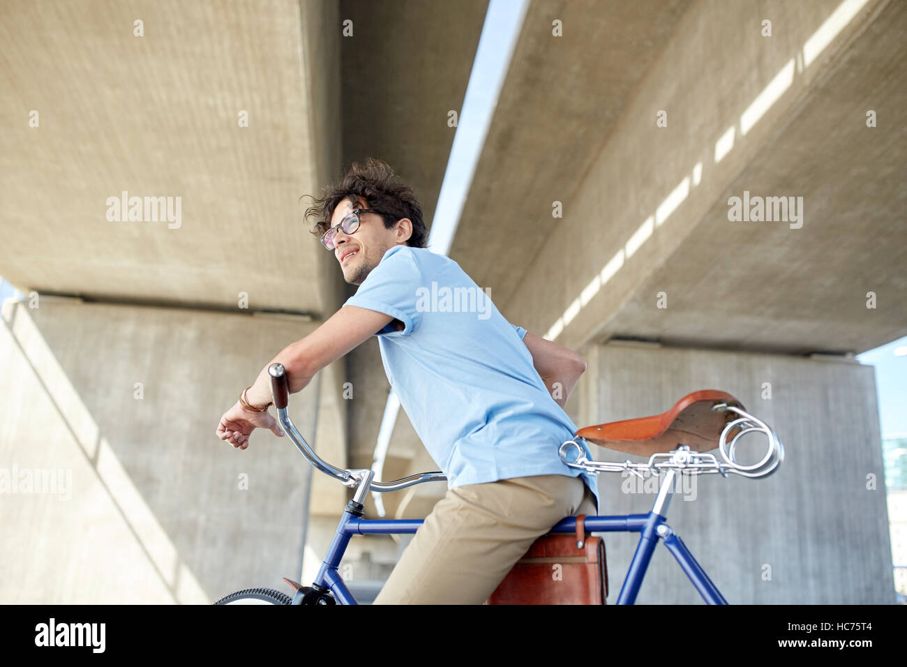 young hipster man riding fixed gear bike Stock Photo - Alamy