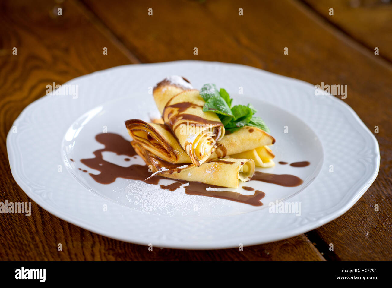 Sweet crepes with hot chocolate nicely docorated for kids menu Stock ...